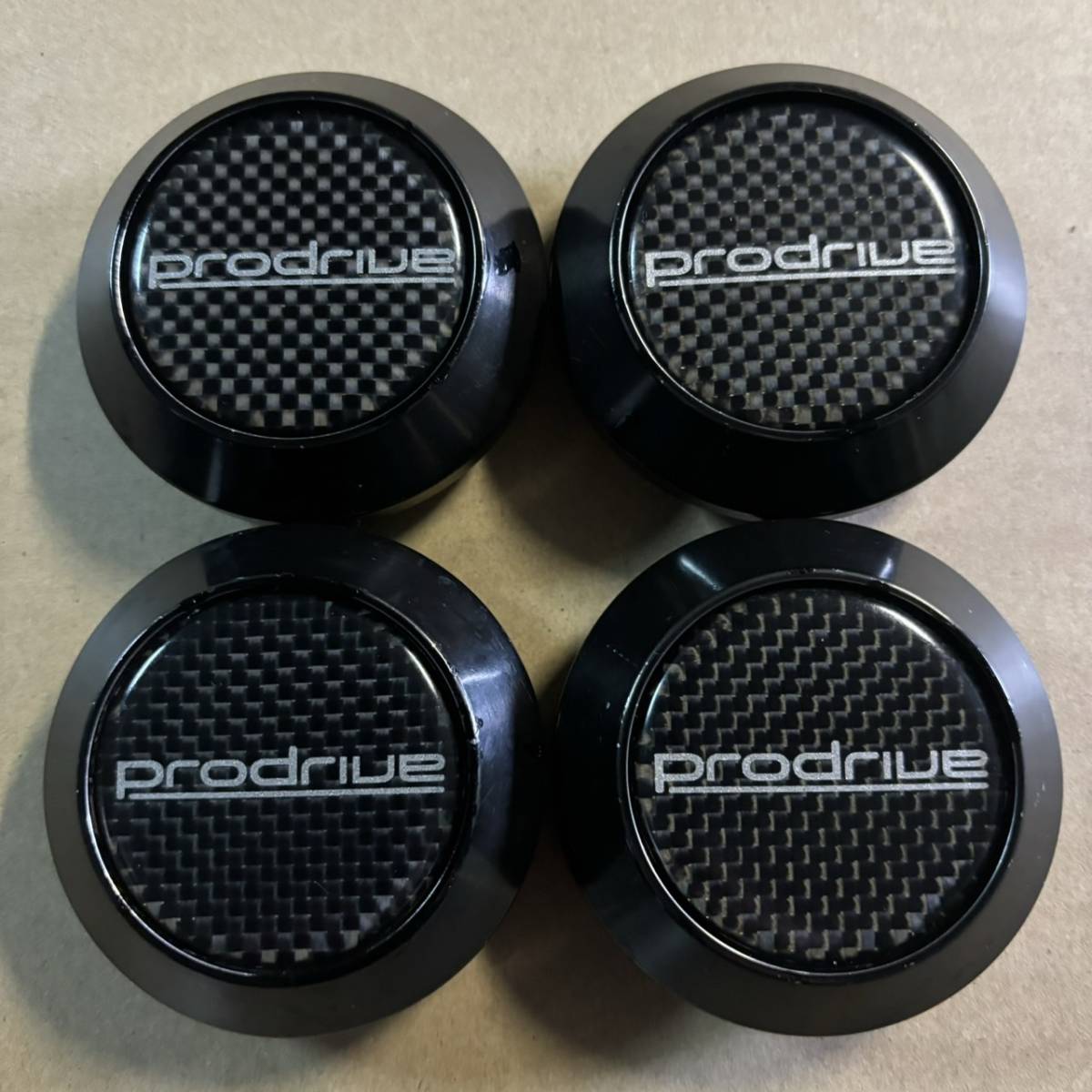 【やや傷や汚れあり】ブリヂストン PRODRIVE プロドライブ カーボン柄 アルミセンターキャップ 4個セット GC-010E GC-06H ...