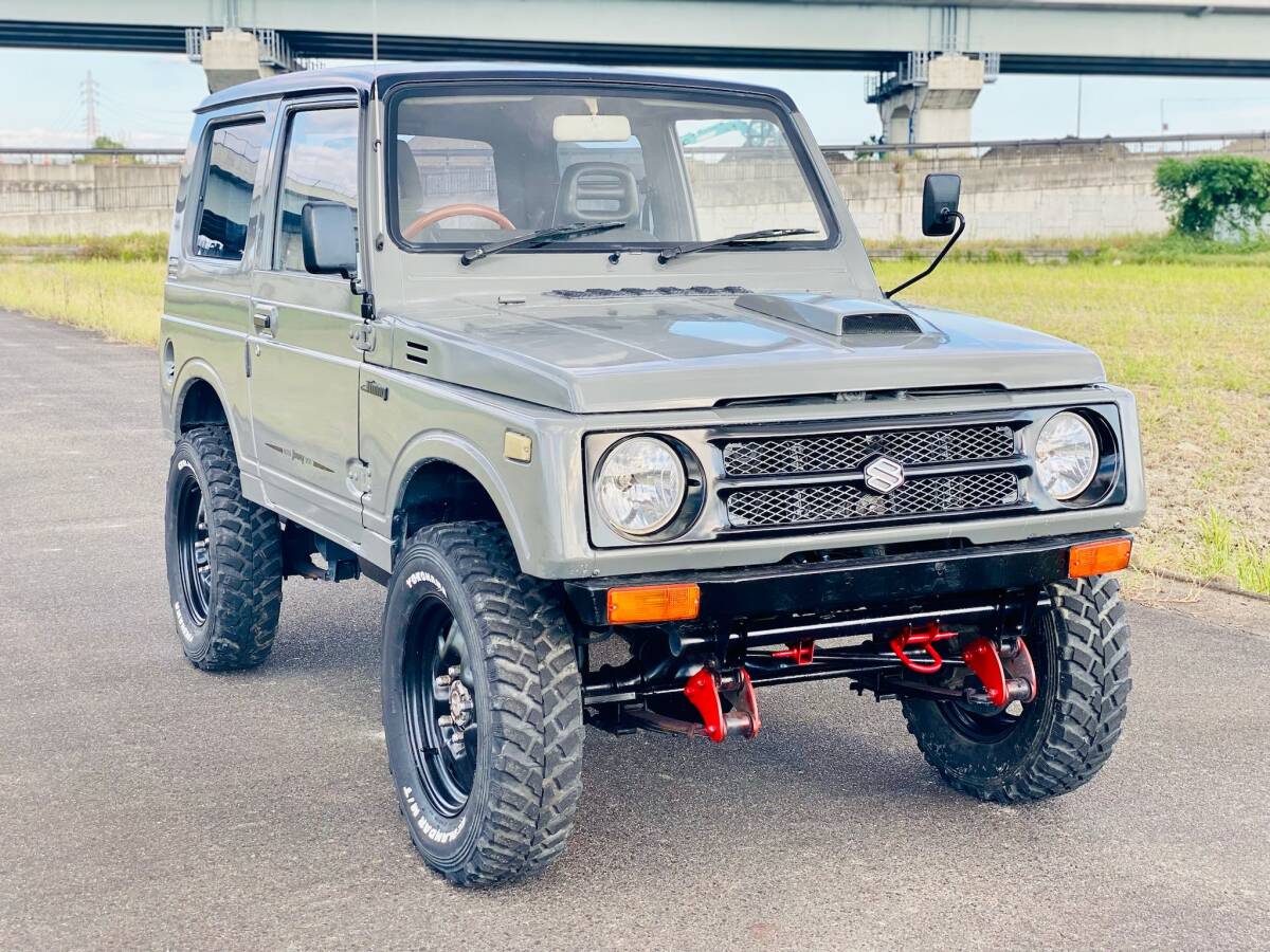 【走行距離 110,895 km】★スズキ ジムニーバンJA11V改/ワイルドウウィンドリミテッド/人気のミディアムグレー！/車検R8年10月/4WD/5F/AC/PS/2インチリフトアップ★ ...